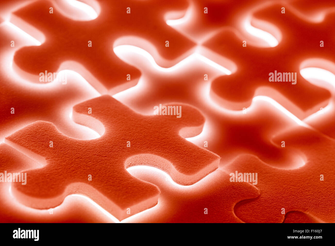 Background of large shining puzzles in red Stock Photo - Alamy