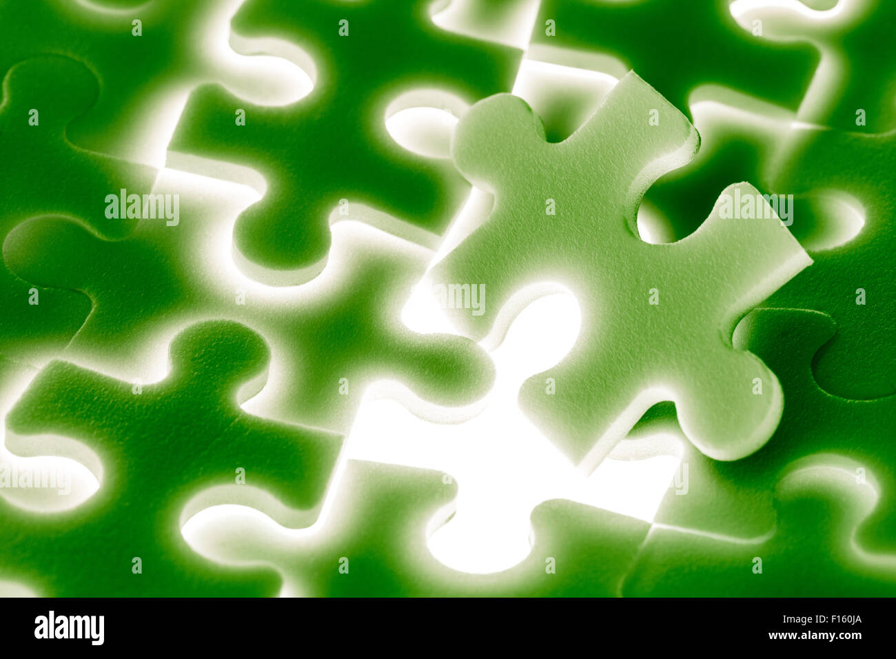 Background of large shining puzzles in green Stock Photo - Alamy