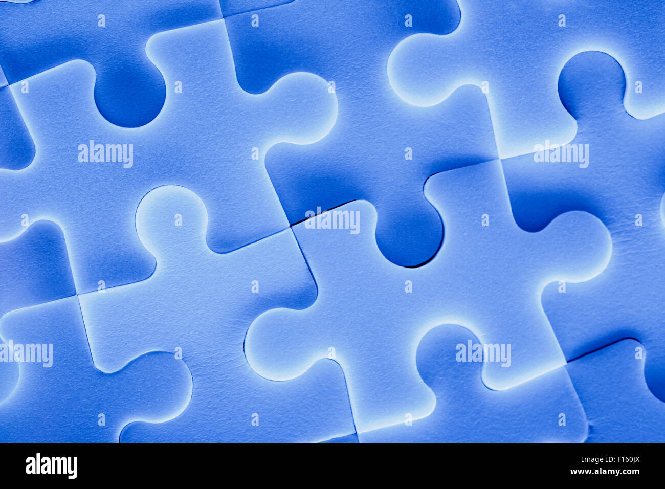 Jigsaw puzzle pieces as background in closeup Stock Photo - Alamy
