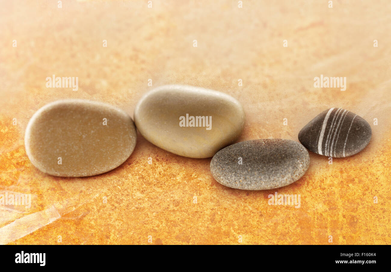 Stones isolated on the textured background Stock Photo - Alamy
