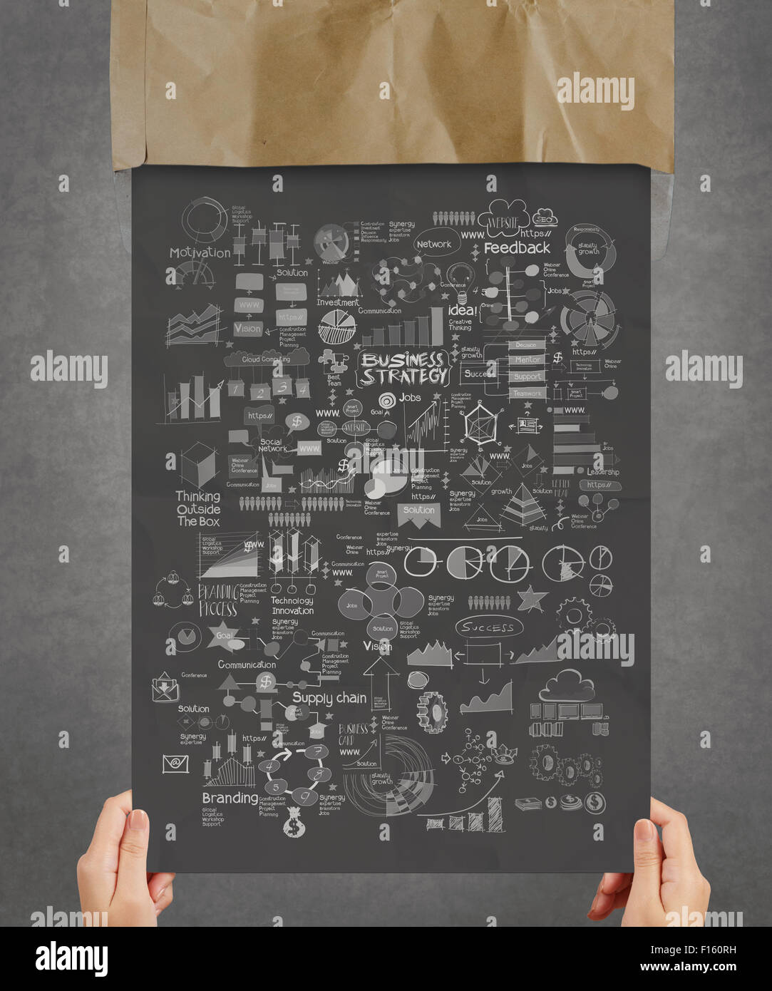 hand holding business strategy on dark paper background poster and ...