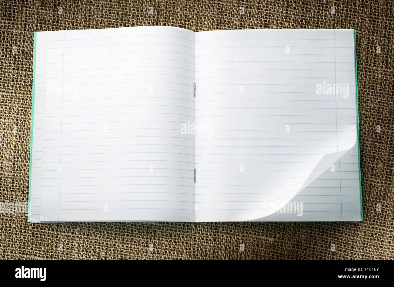 Opened blank notebook with folded left corner Stock Photo - Alamy