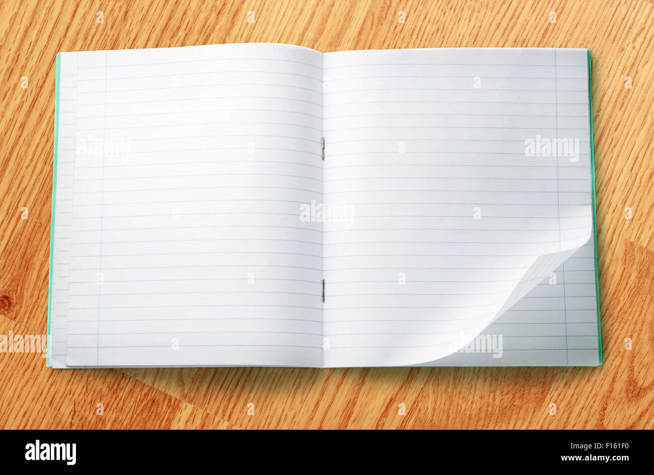 Opened blank notebook with folded left corner Stock Photo - Alamy