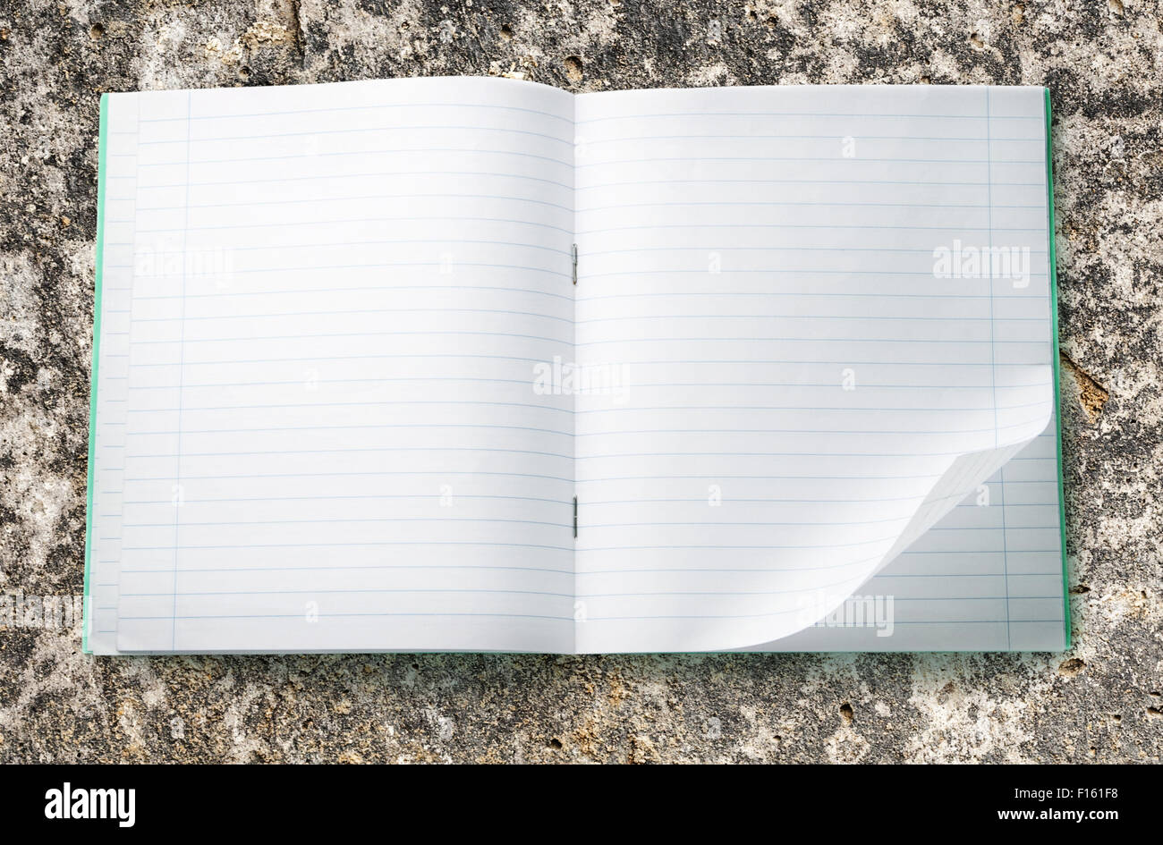 Opened blank notebook with folded left corner Stock Photo - Alamy