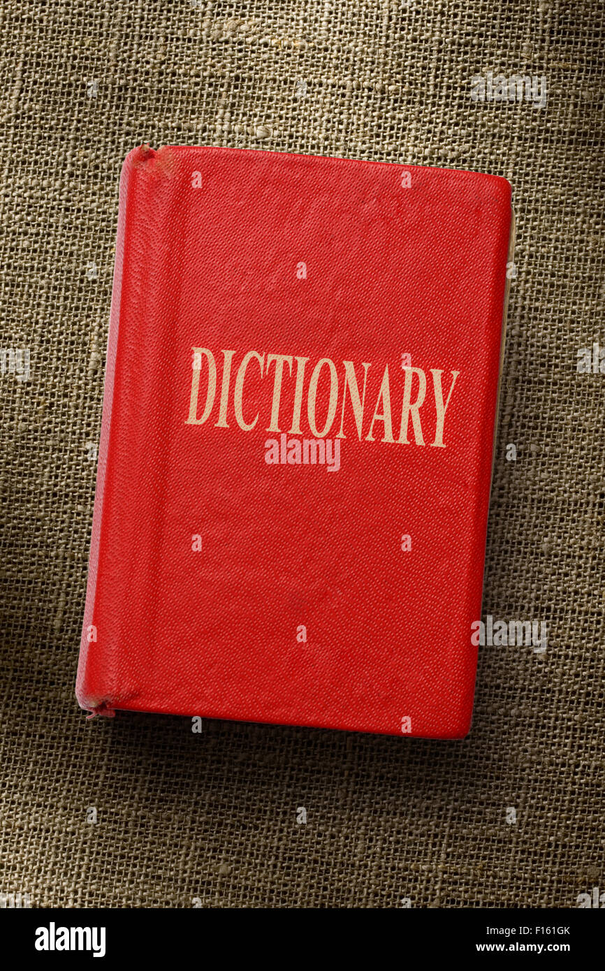 Old red dictionary on the sack background Stock Photo - Alamy