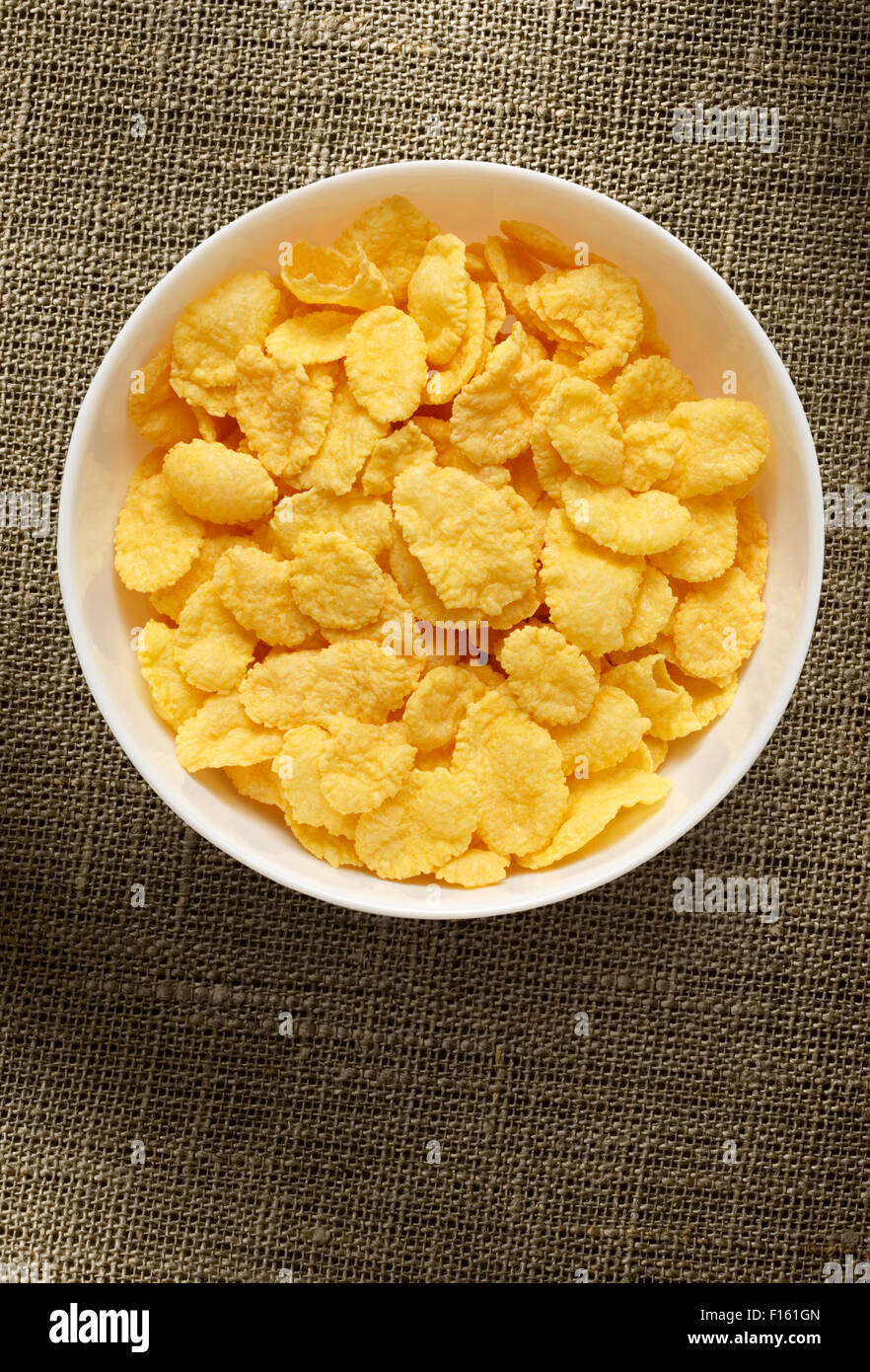 Yellow corn flakes in the white bowl Stock Photo - Alamy