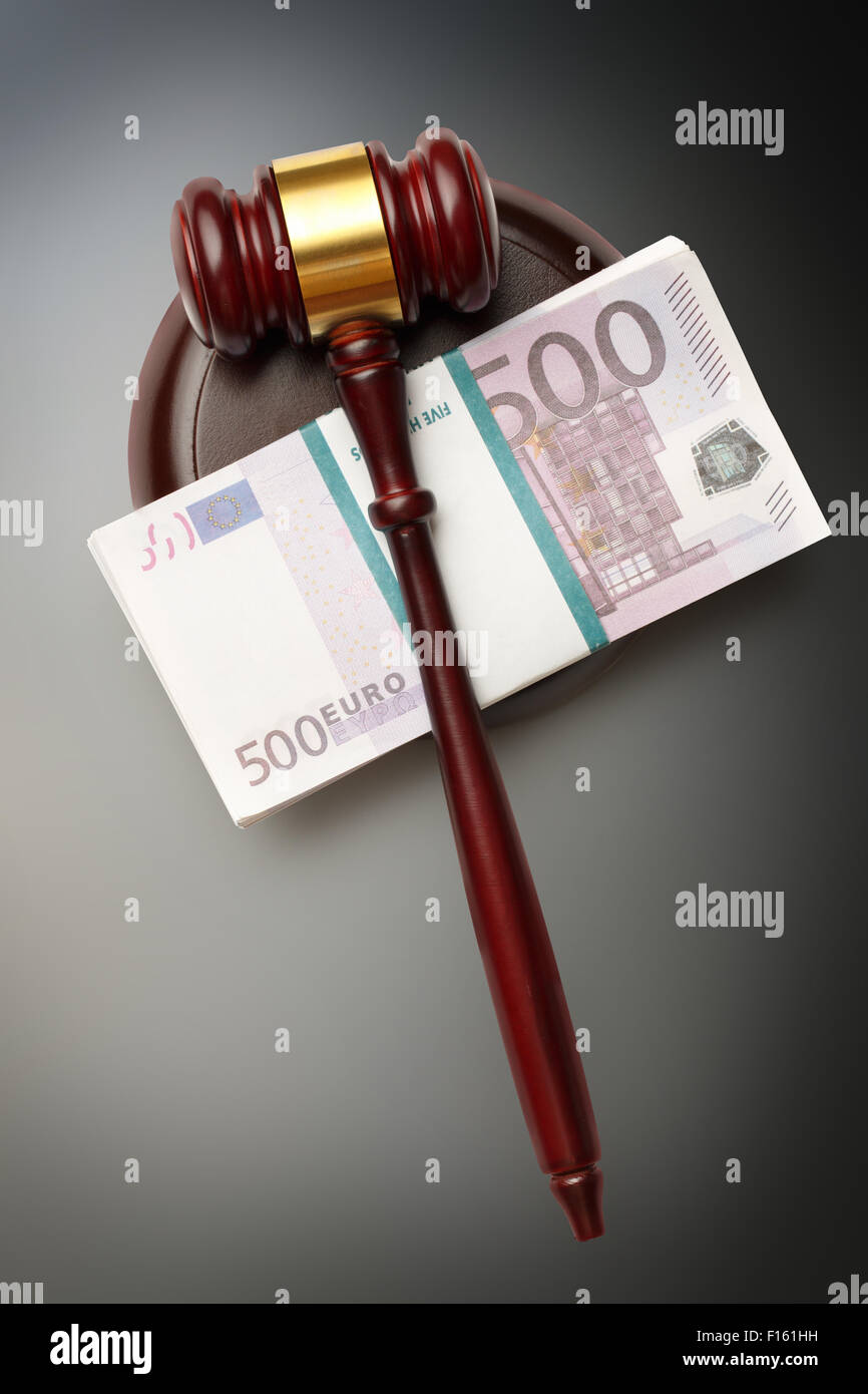 Wooden judge's gavel and money Stock Photo - Alamy