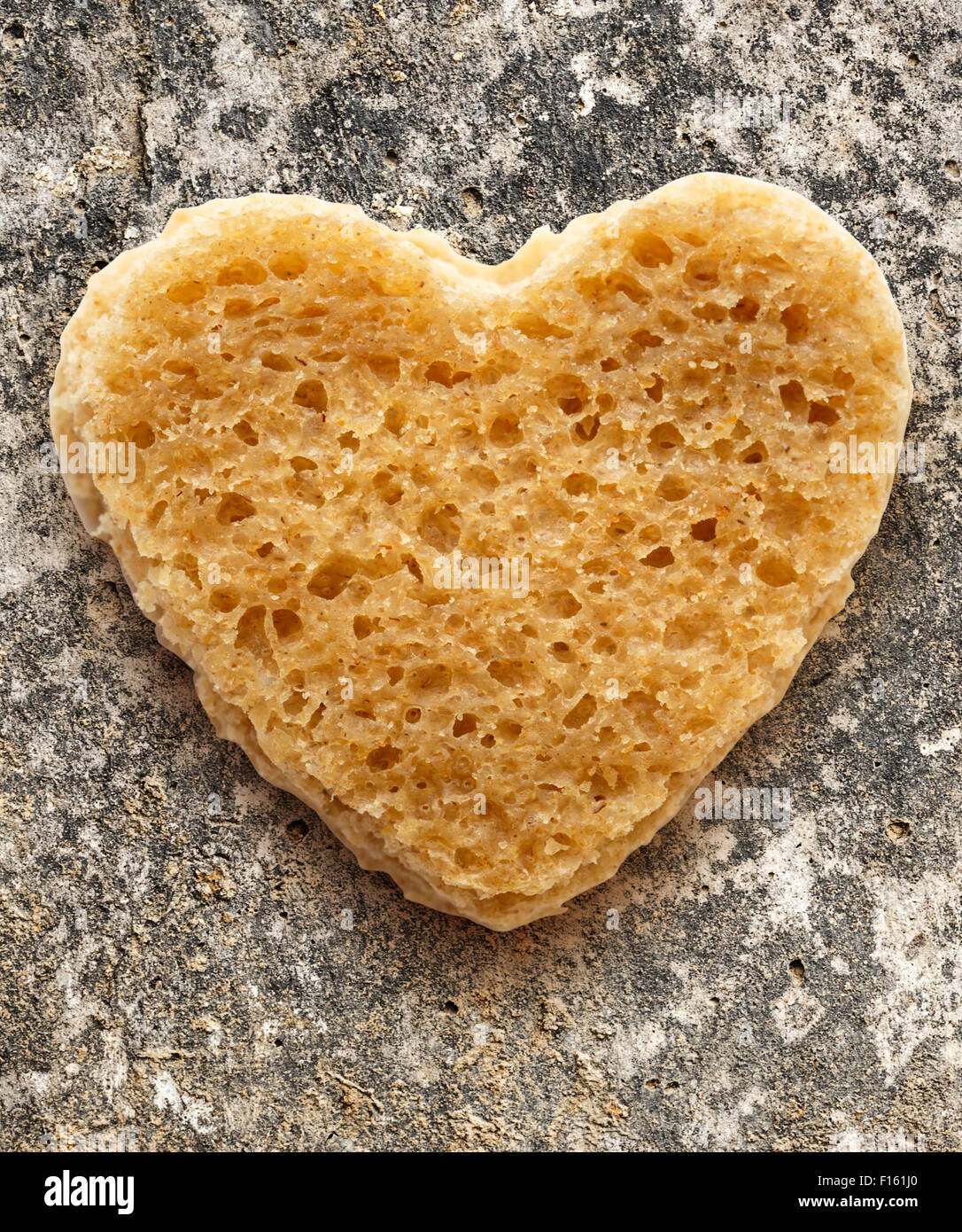 Slice of bread in heart form single Stock Photo - Alamy