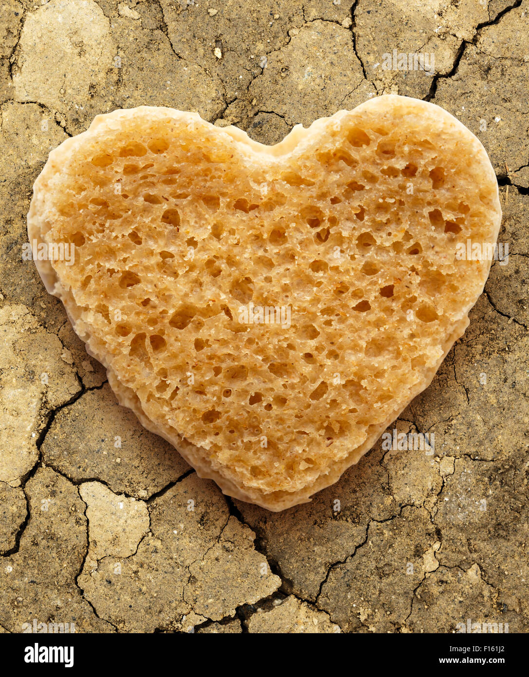 Slice of bread in heart form single Stock Photo - Alamy