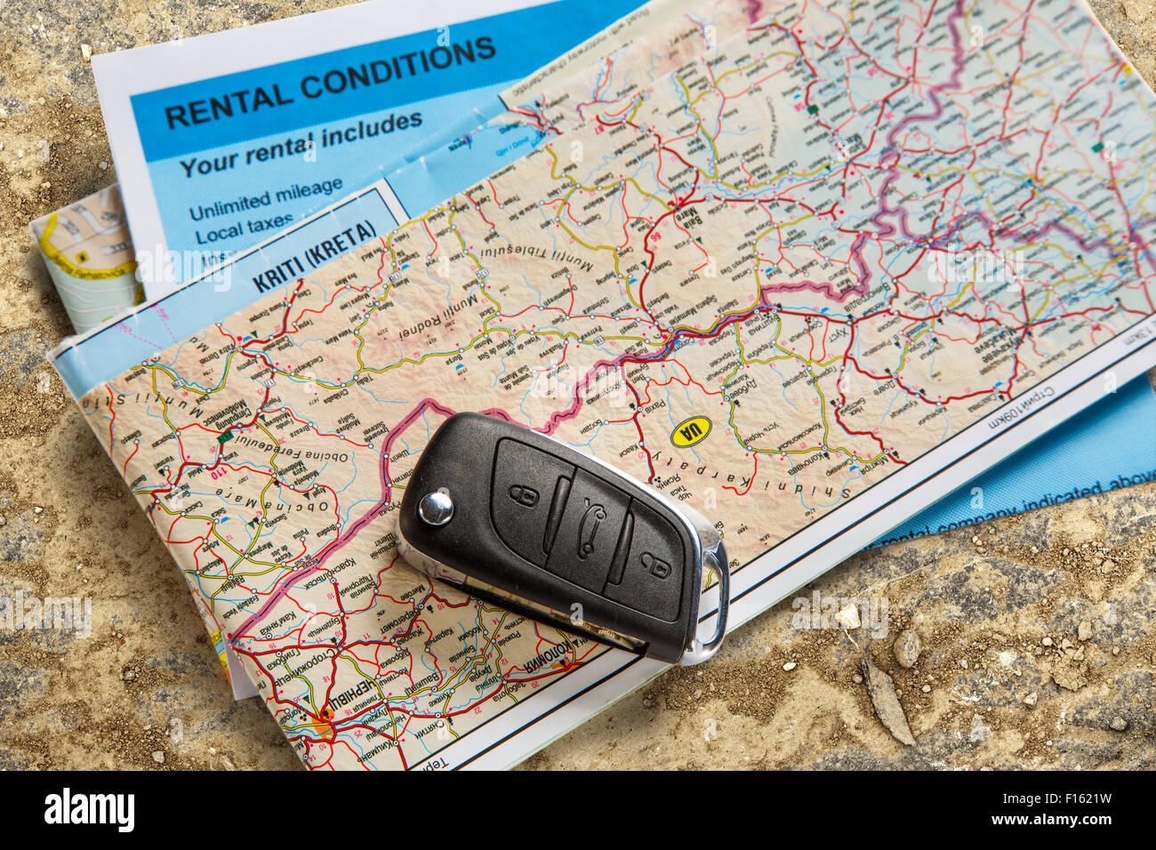 Car remote key on map and rental agreement Stock Photo - Alamy