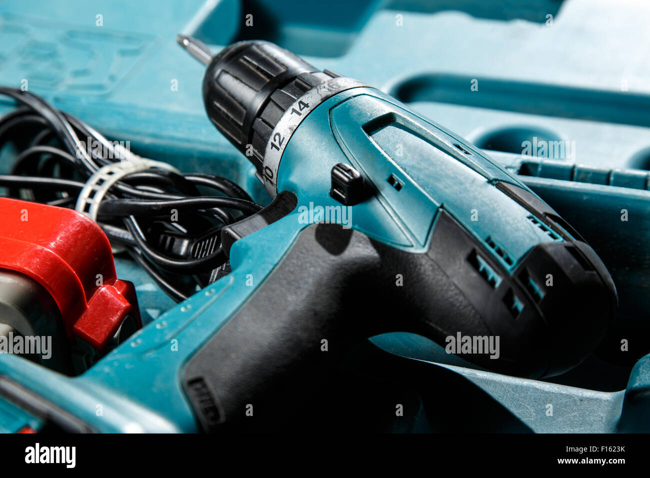 Blue screwdriver in the box with tools Stock Photo - Alamy