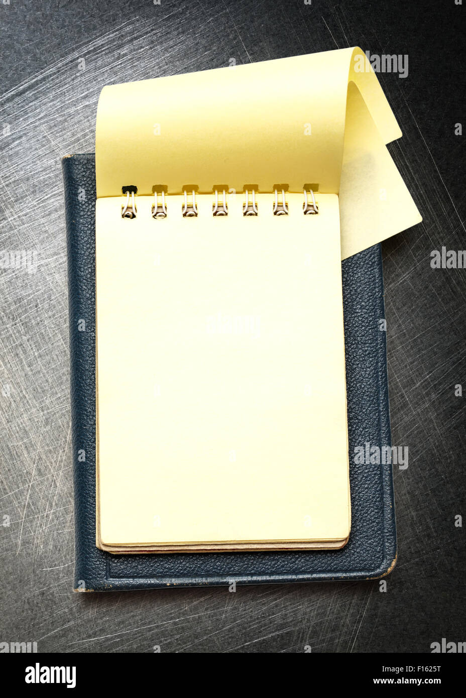 Yellow blank notepad with open page closeup Stock Photo - Alamy