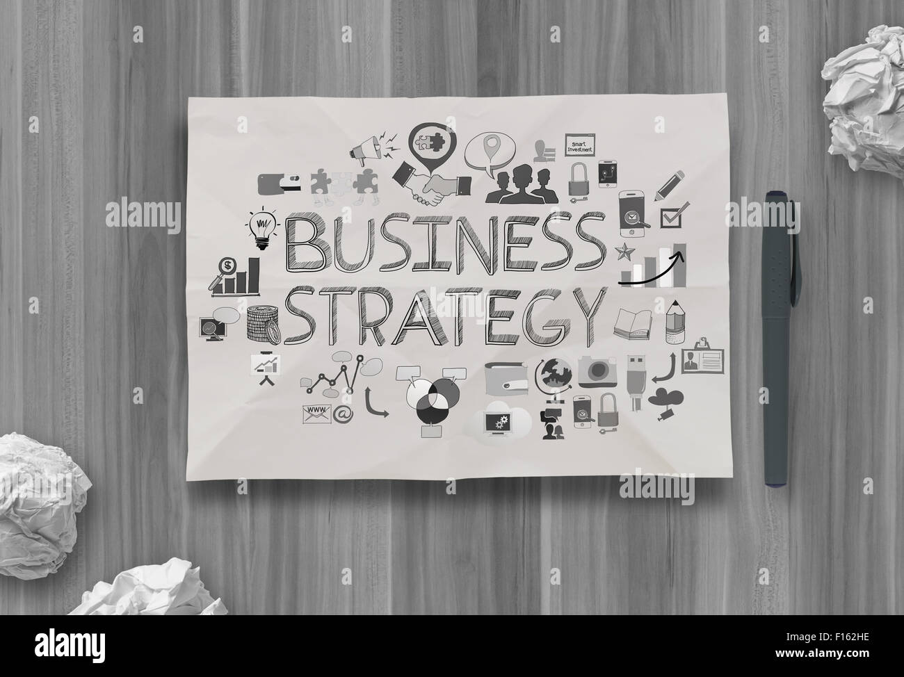 hand drawn business strategy on crumpled paper background as concept ...
