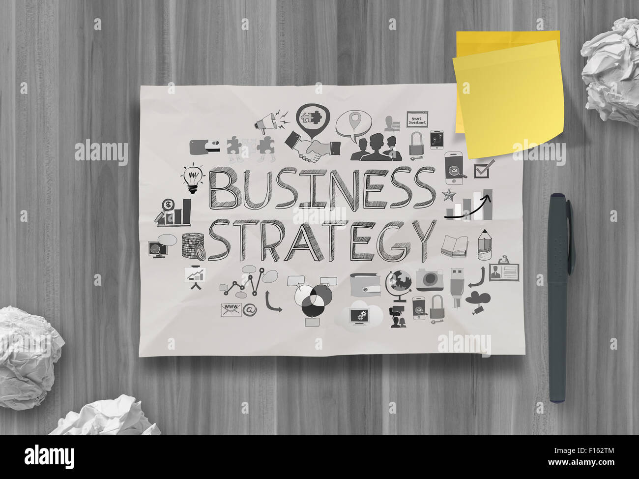 hand drawn business strategy on crumpled paper background as concept ...