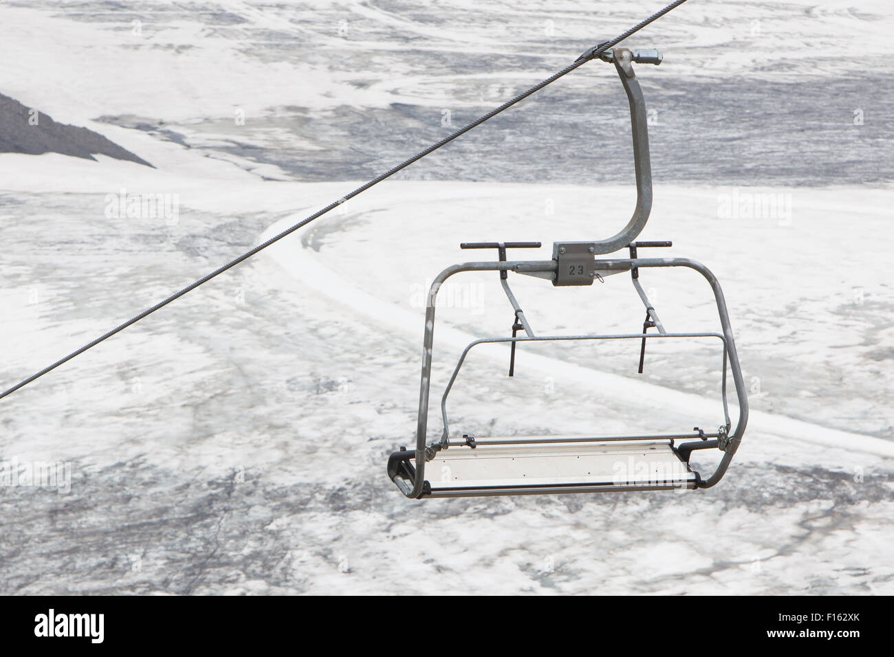 Empty ski lift above snow, mountains in Switzerland Stock Photo - Alamy