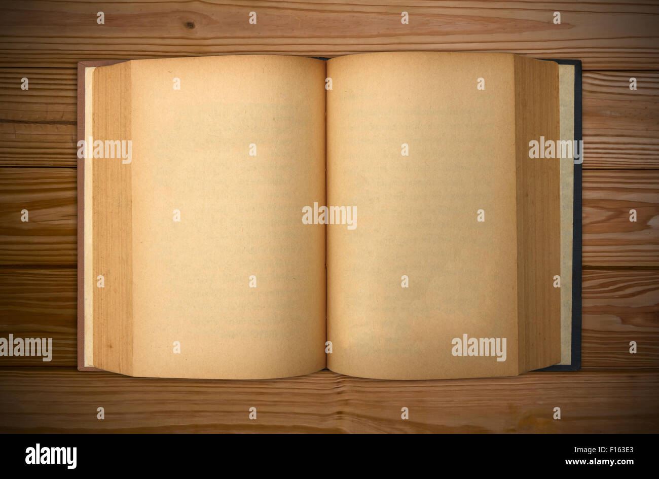 Old book Open two face on wood Stock Photo - Alamy
