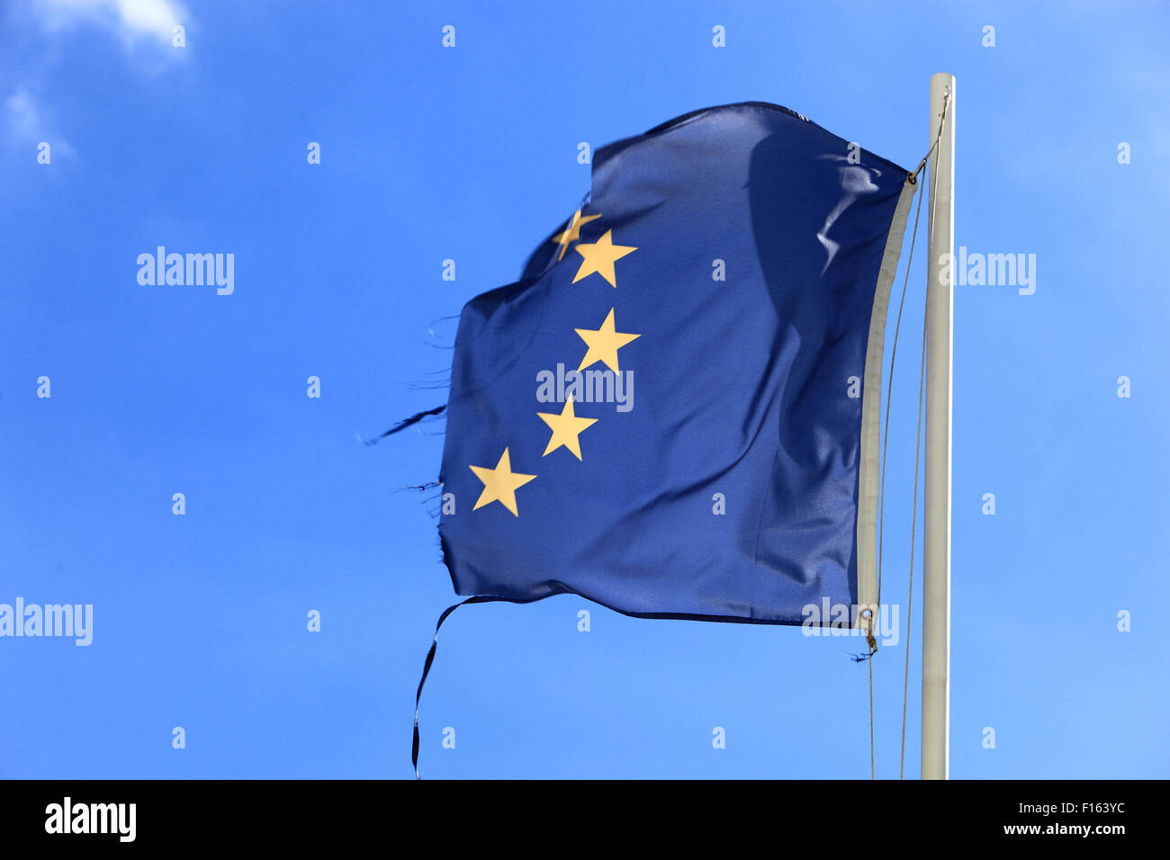 Ripped EU flag fluttering in the wind Stock Photo - Alamy