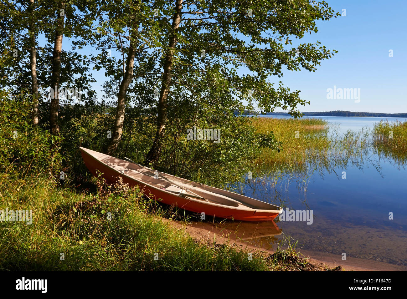 stranded row boat, Finland Stock Photo - Alamy