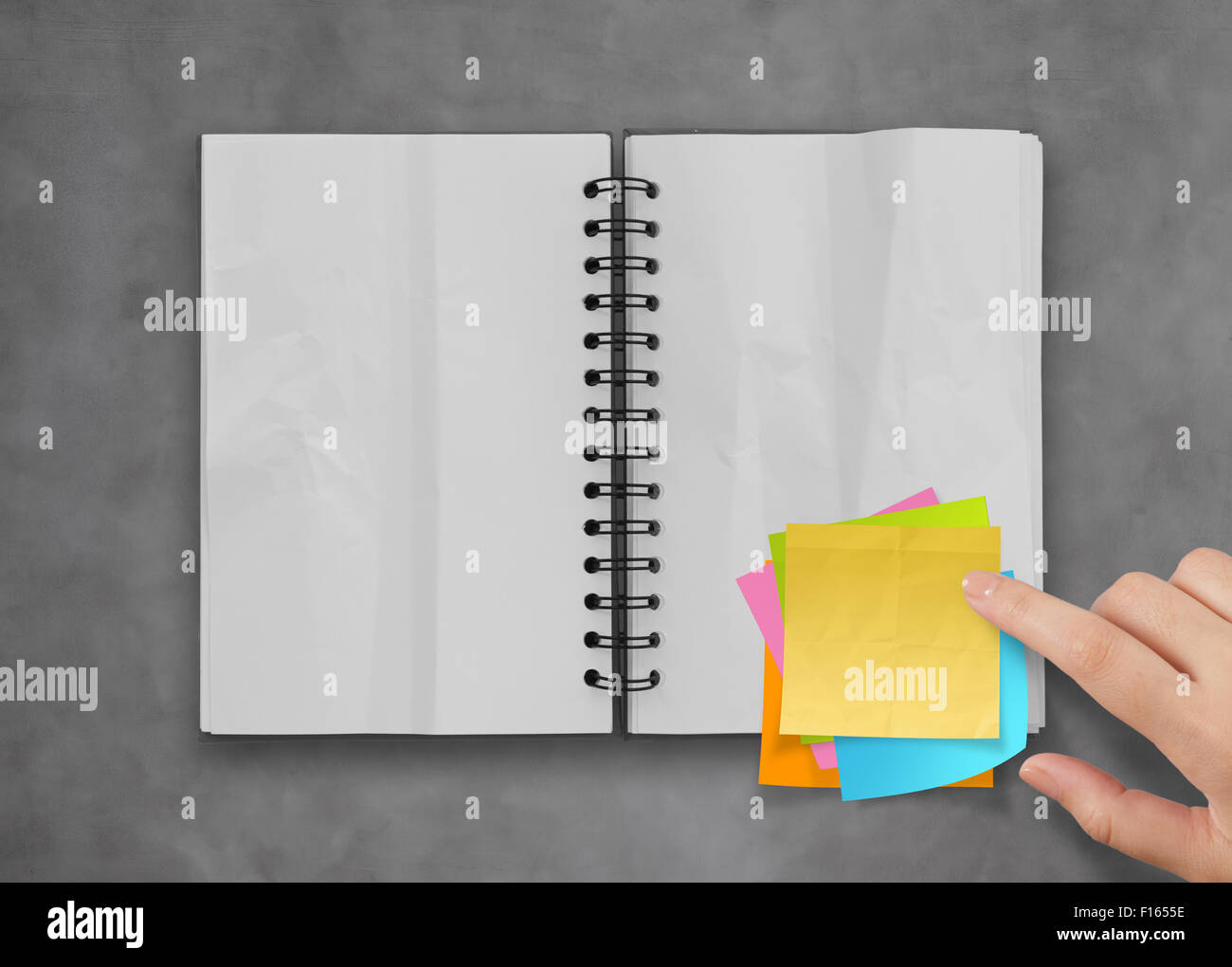 sticky notes with open blank note book on desk top texture Stock Photo ...