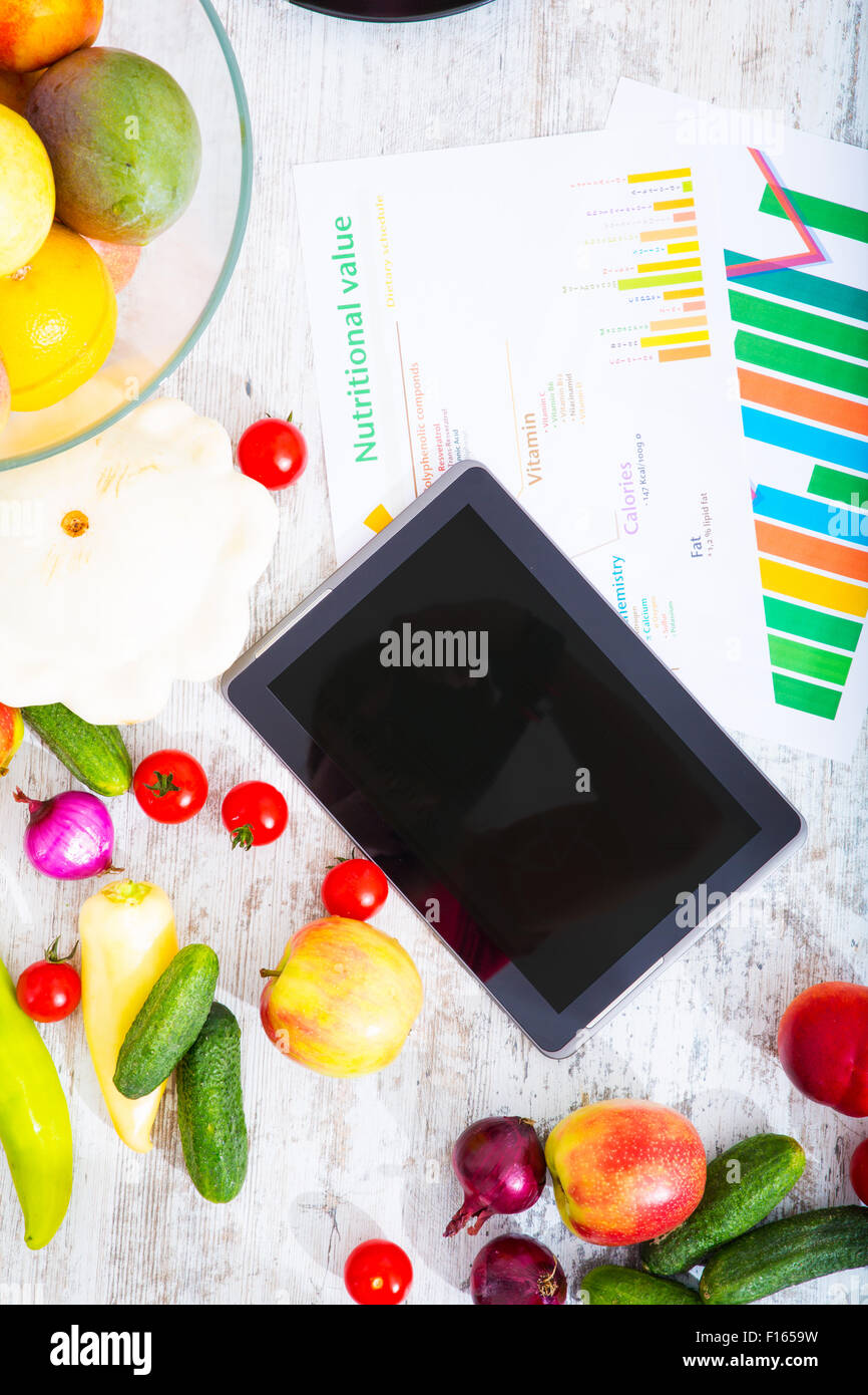 Organic fruit and vegetable on the table with a tablet PC Stock Photo ...