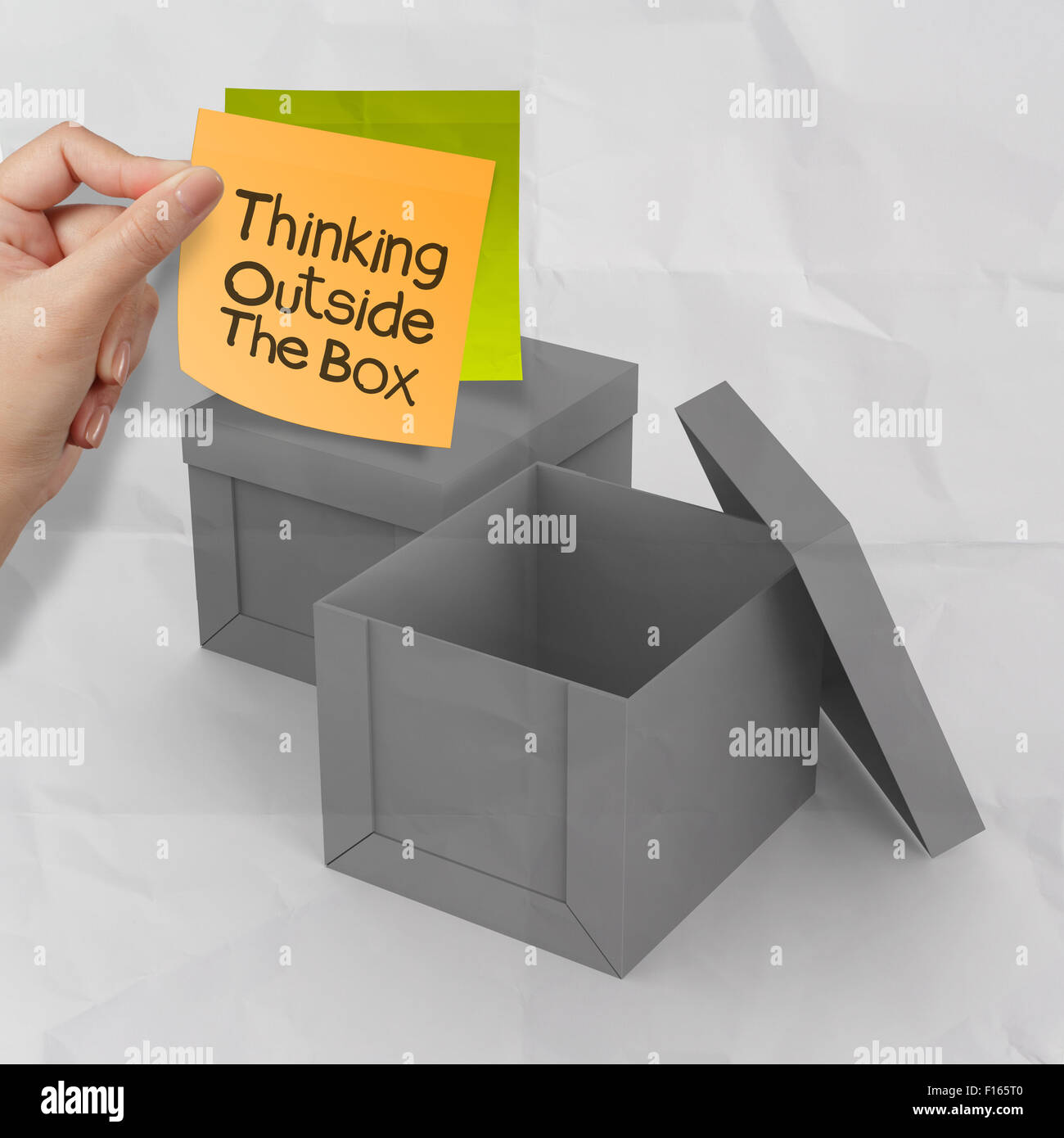 thinking outside the box on crumpled sticky note paper as concept Stock ...
