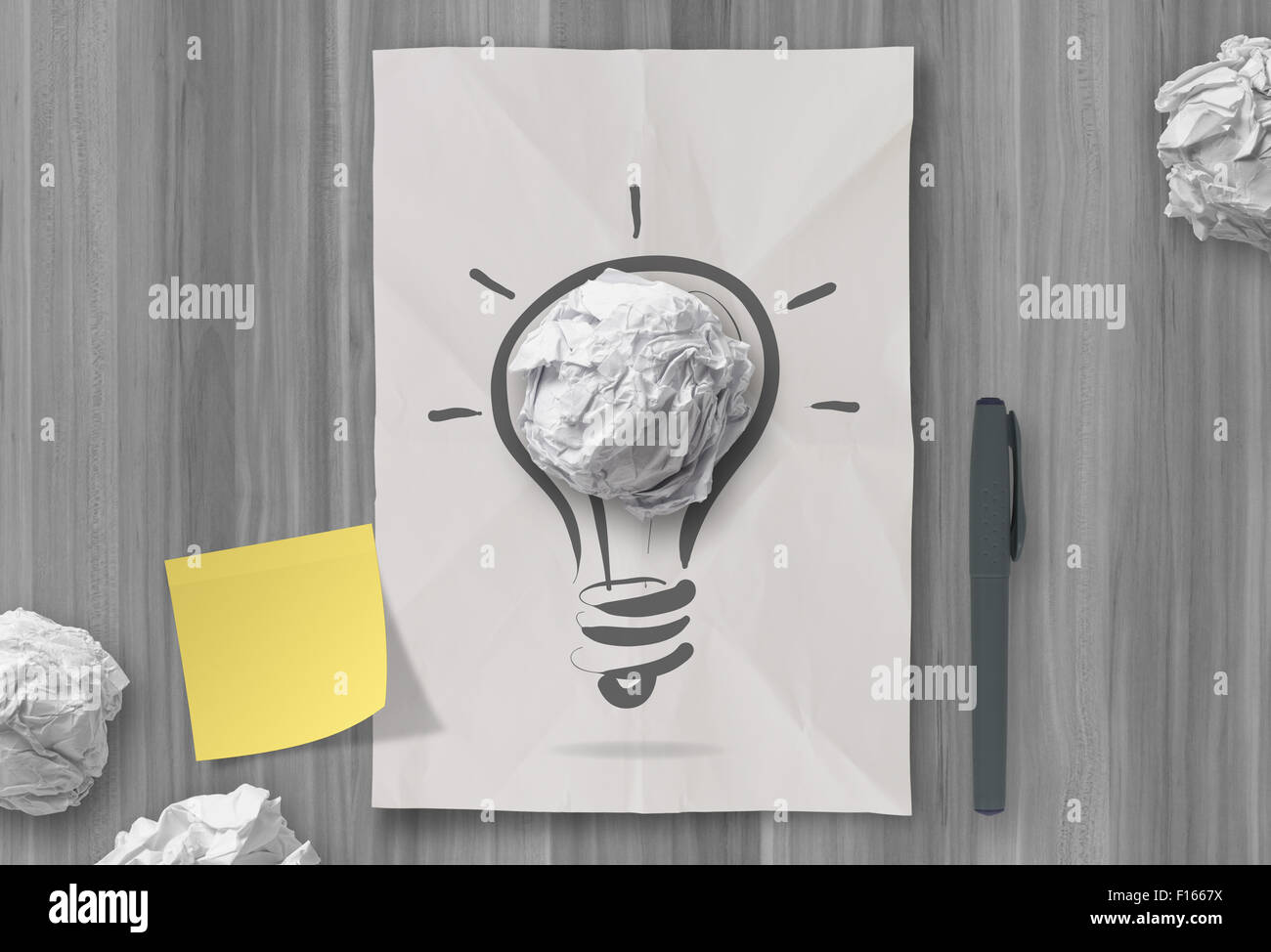 sticky note with another idea light bulb on crumpled paper as creative ...