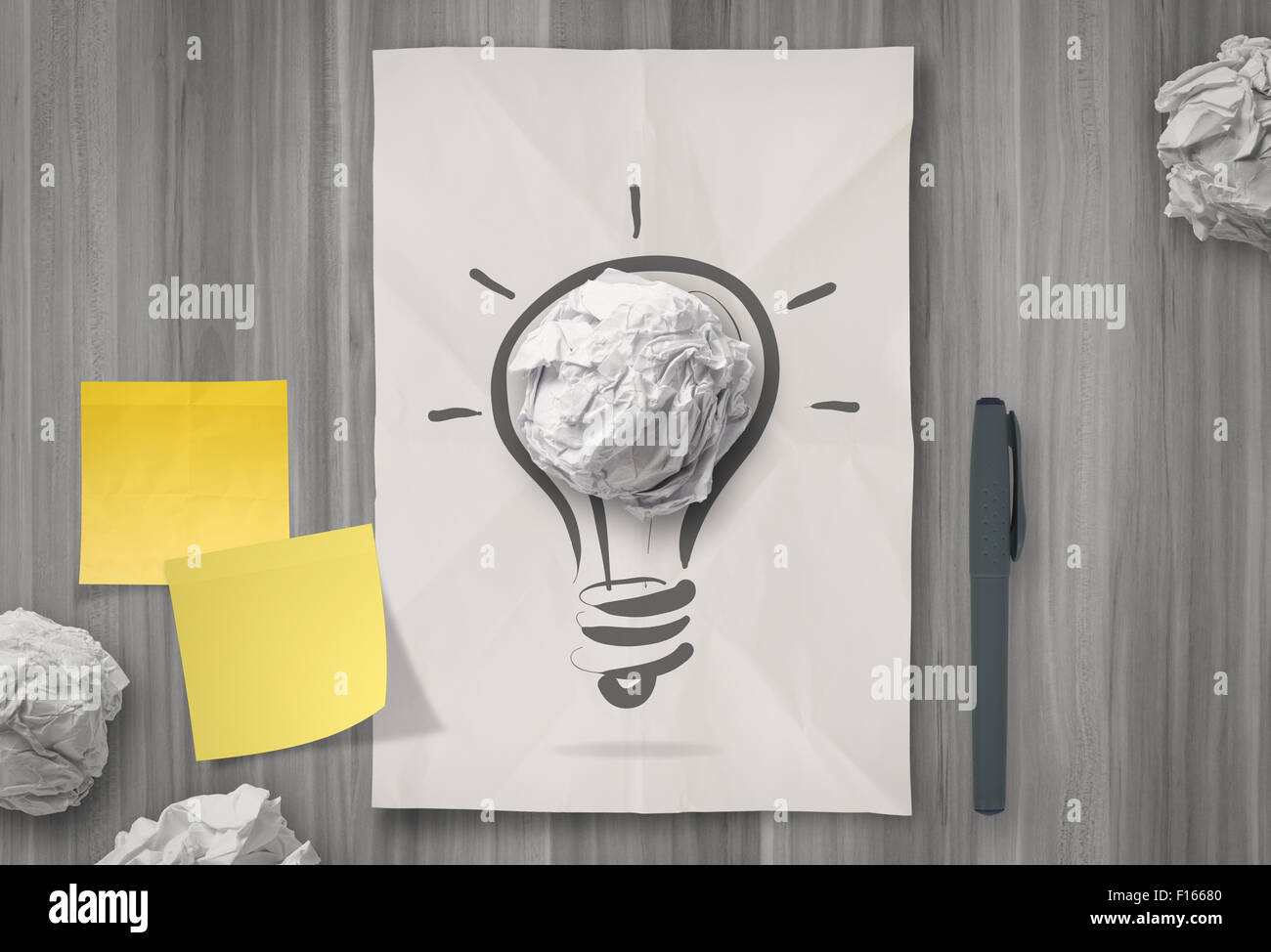 sticky note with another idea light bulb on crumpled paper as creative ...