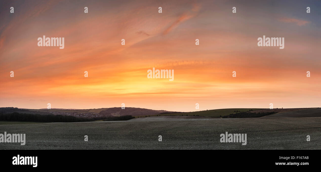 Stunning sunset over farm landscape with vibrant colors Stock Photo - Alamy