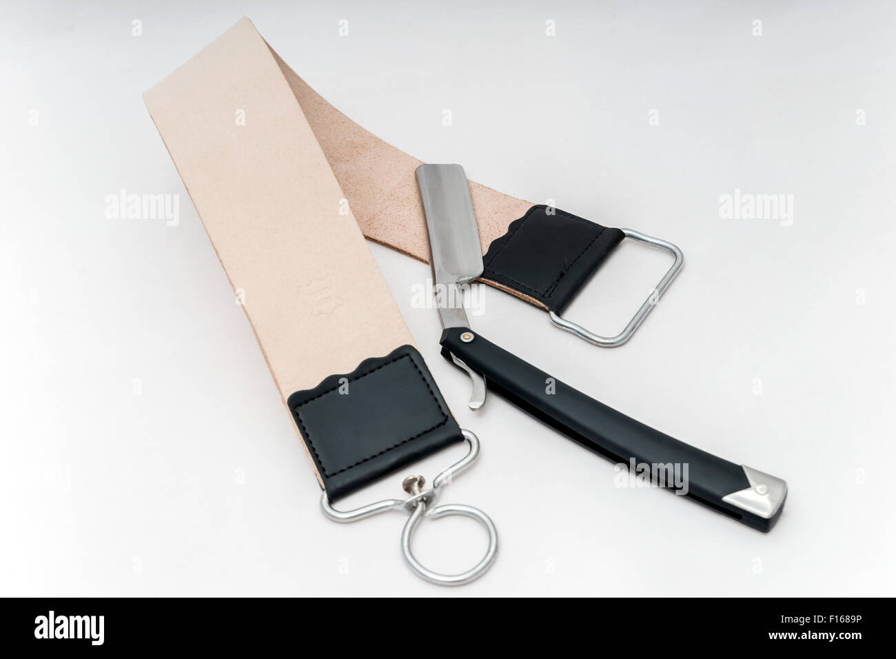 Open razor with leather strap Stock Photo - Alamy