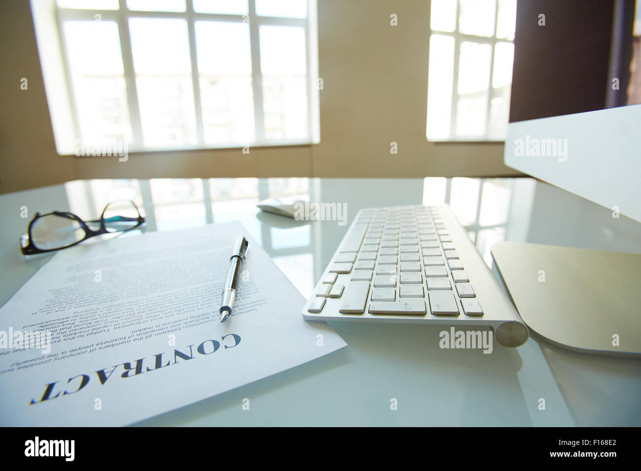 Close-up of contract on empty workplace Stock Photo - Alamy