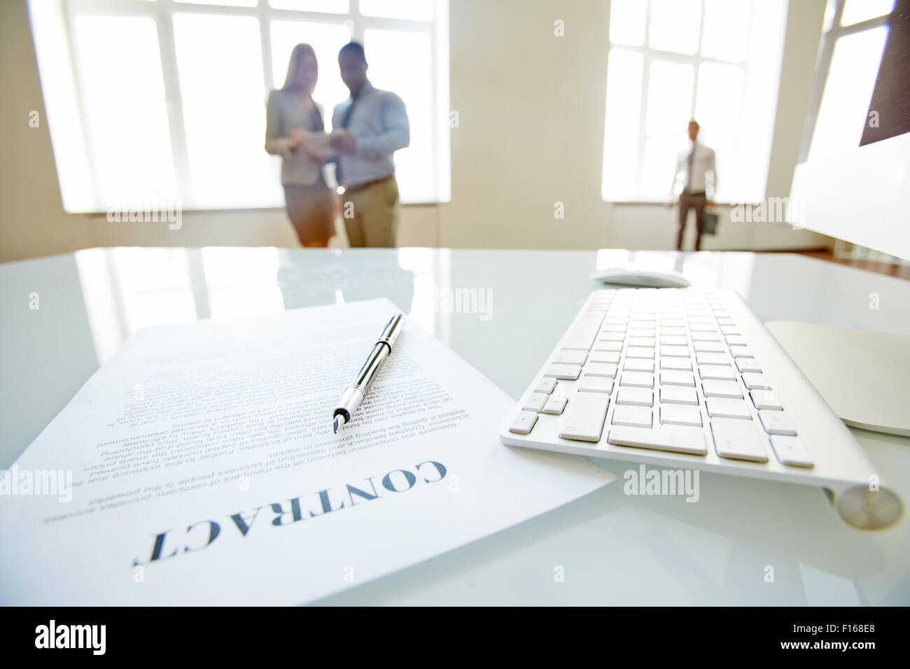 Businesspeople going to sign a contract Stock Photo - Alamy