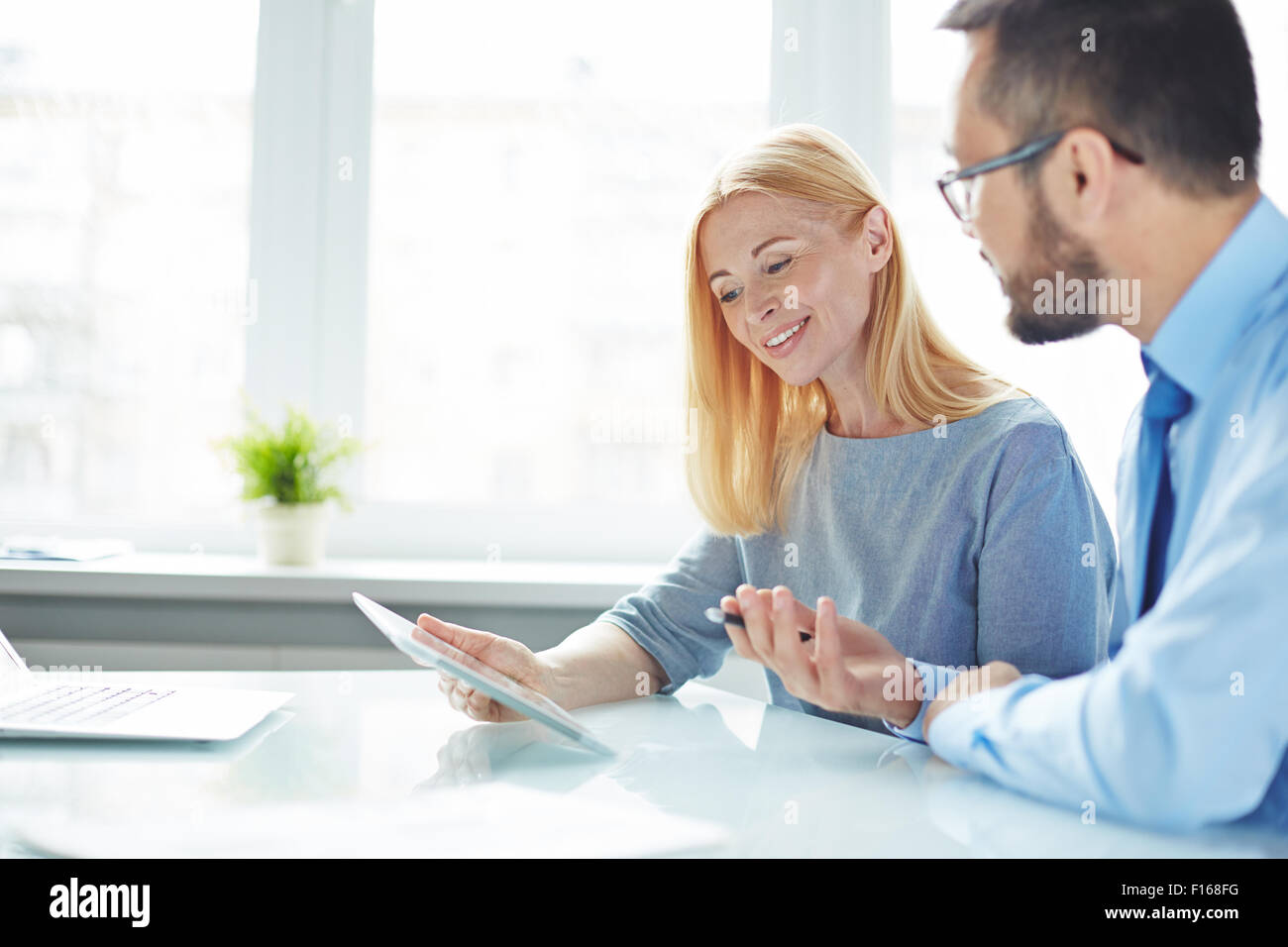 Manager explaining his strategy to chief Stock Photo - Alamy
