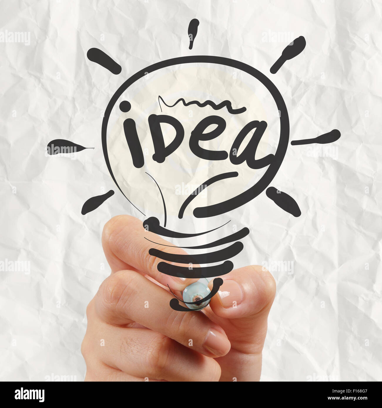 hand drawing light bulb with crumpled paper as creative concept Stock ...