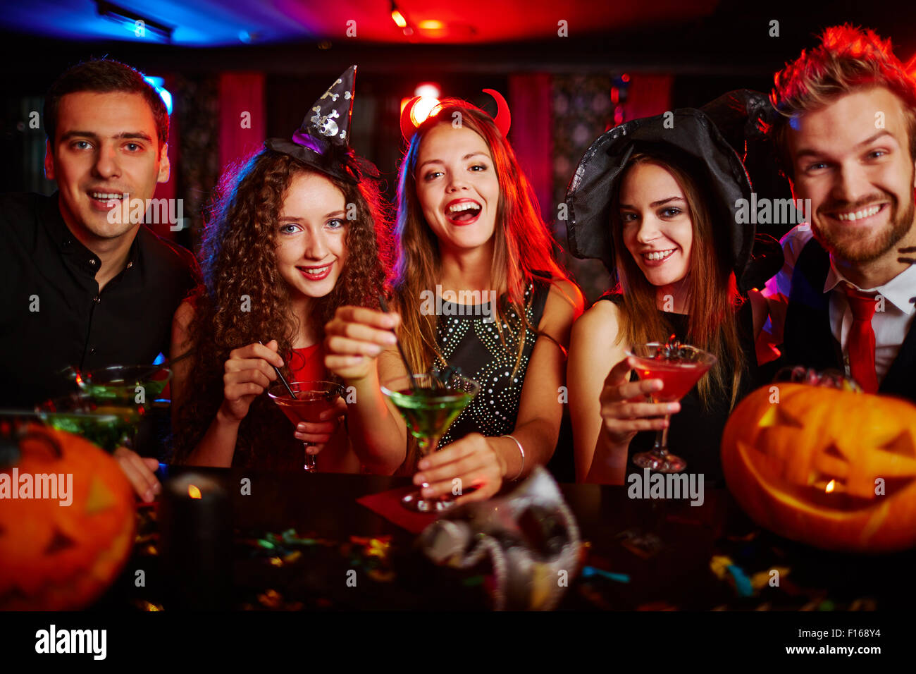 Friends resting in nightclub at Halloween Stock Photo - Alamy