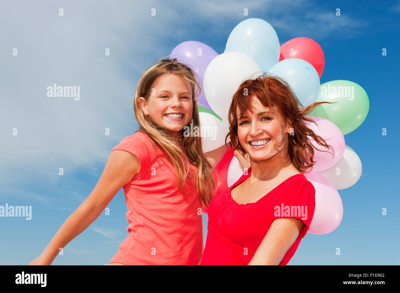 Happy girls outdoors Stock Photo - Alamy