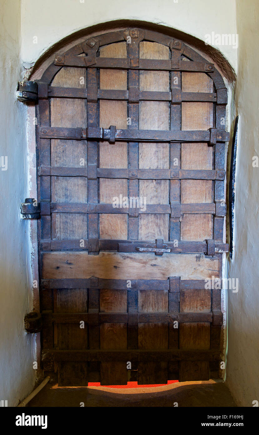 Fortified door into the tower of St Cuthbert's Church in the village of ...