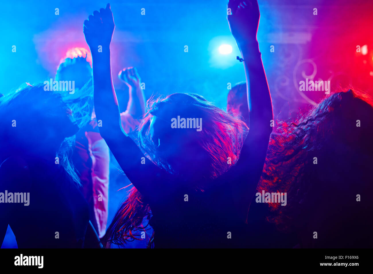 Woman dancing in spotlights Stock Photo - Alamy