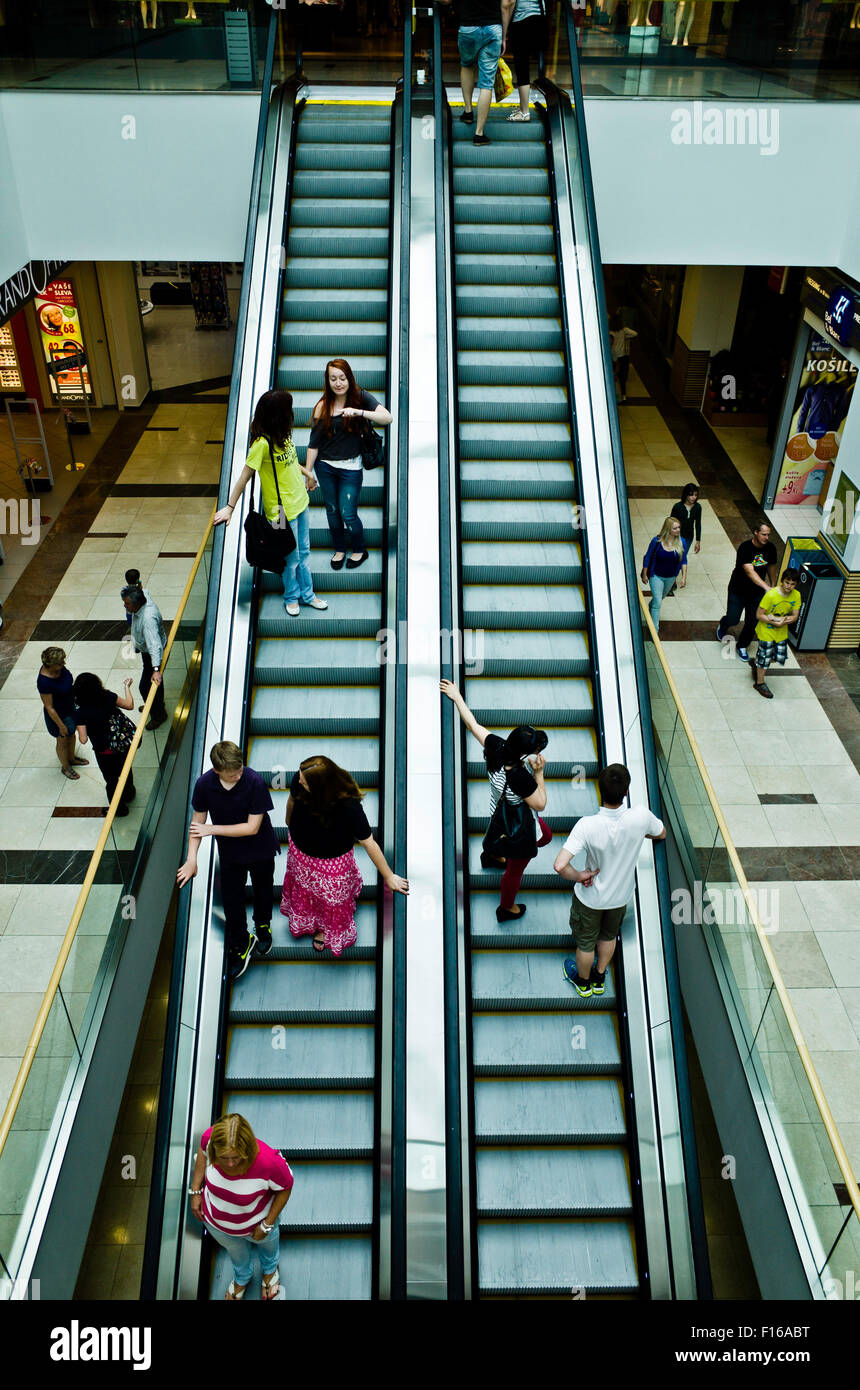 people on escalators in a shopping mall Stock Photo - Alamy