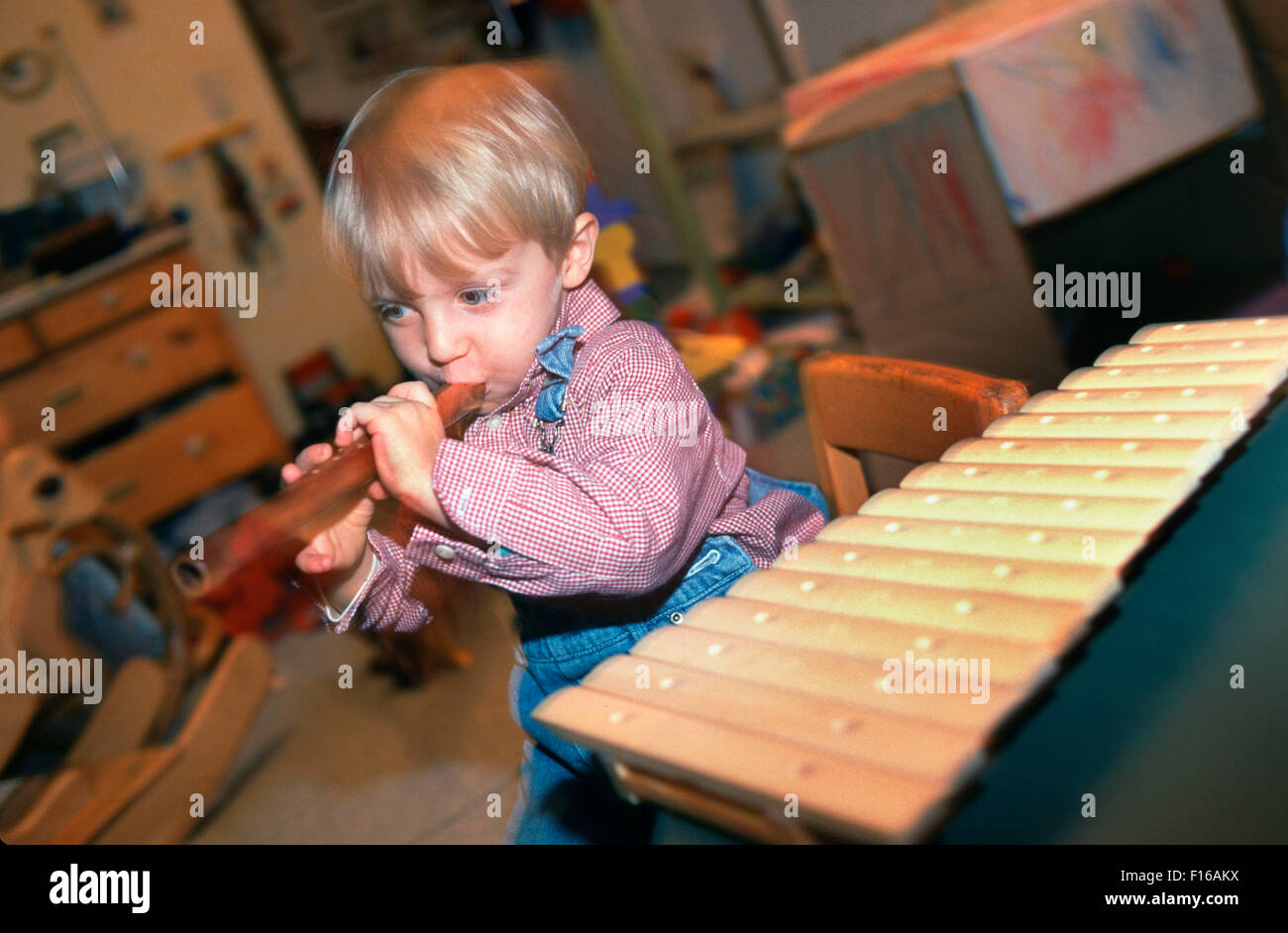 Child playing music Stock Photo - Alamy