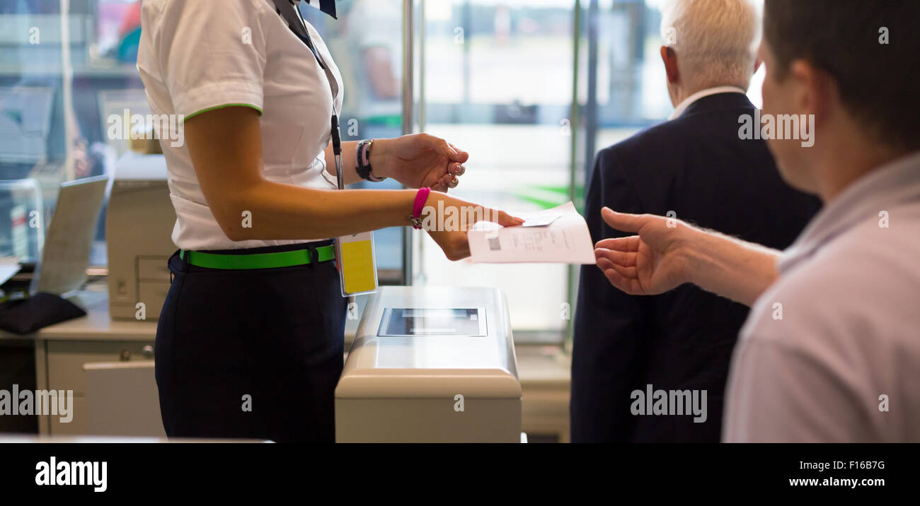 Passenger handing over air ticket at airline check in counter Stock ...