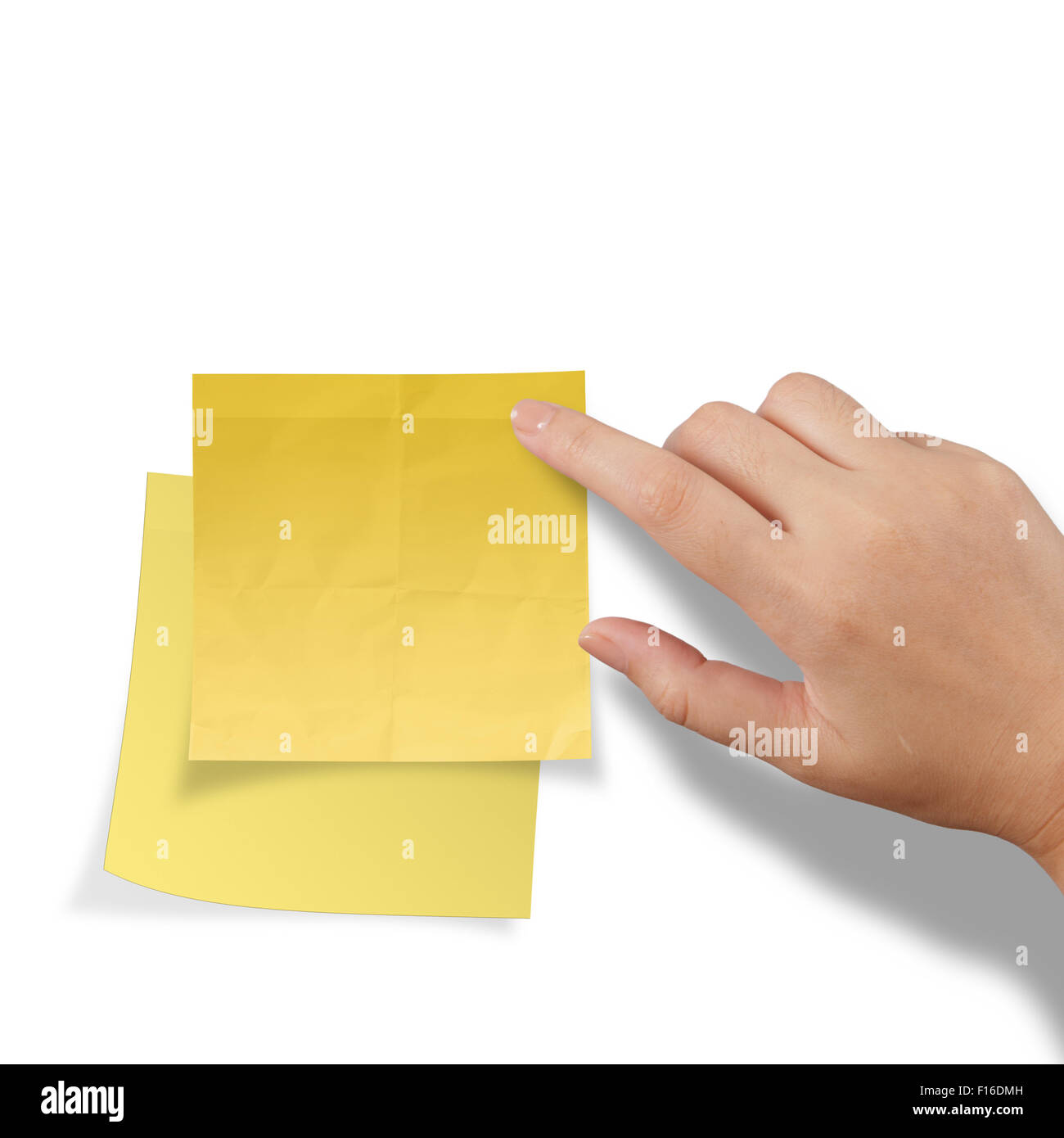 hand touch blank yellow sticky note on white background Stock Photo - Alamy