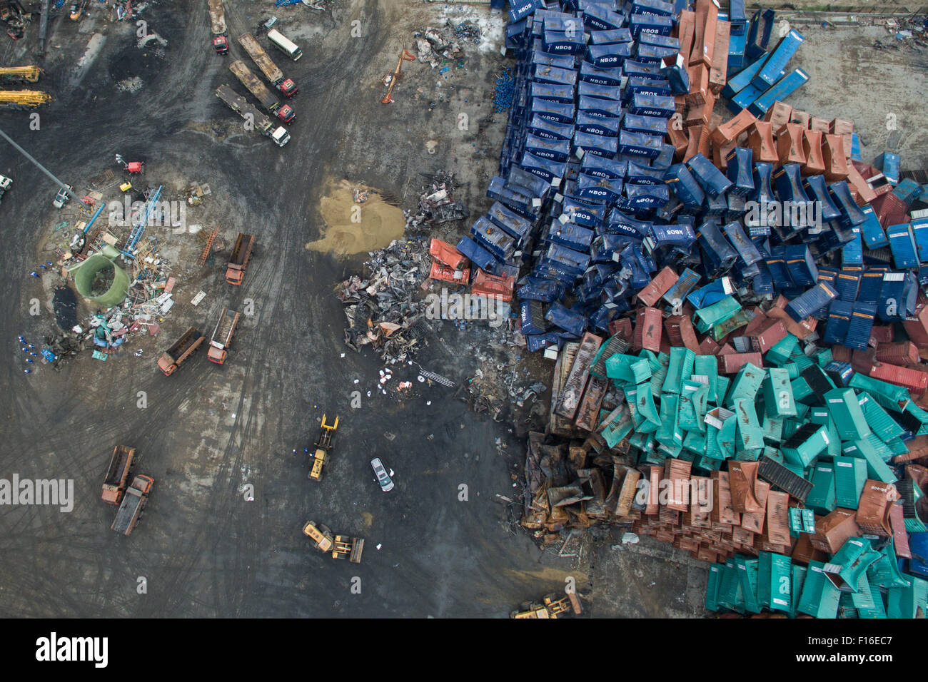 Tianjin. 28th Aug, 2015. Rescuers clean up containers at the accident ...
