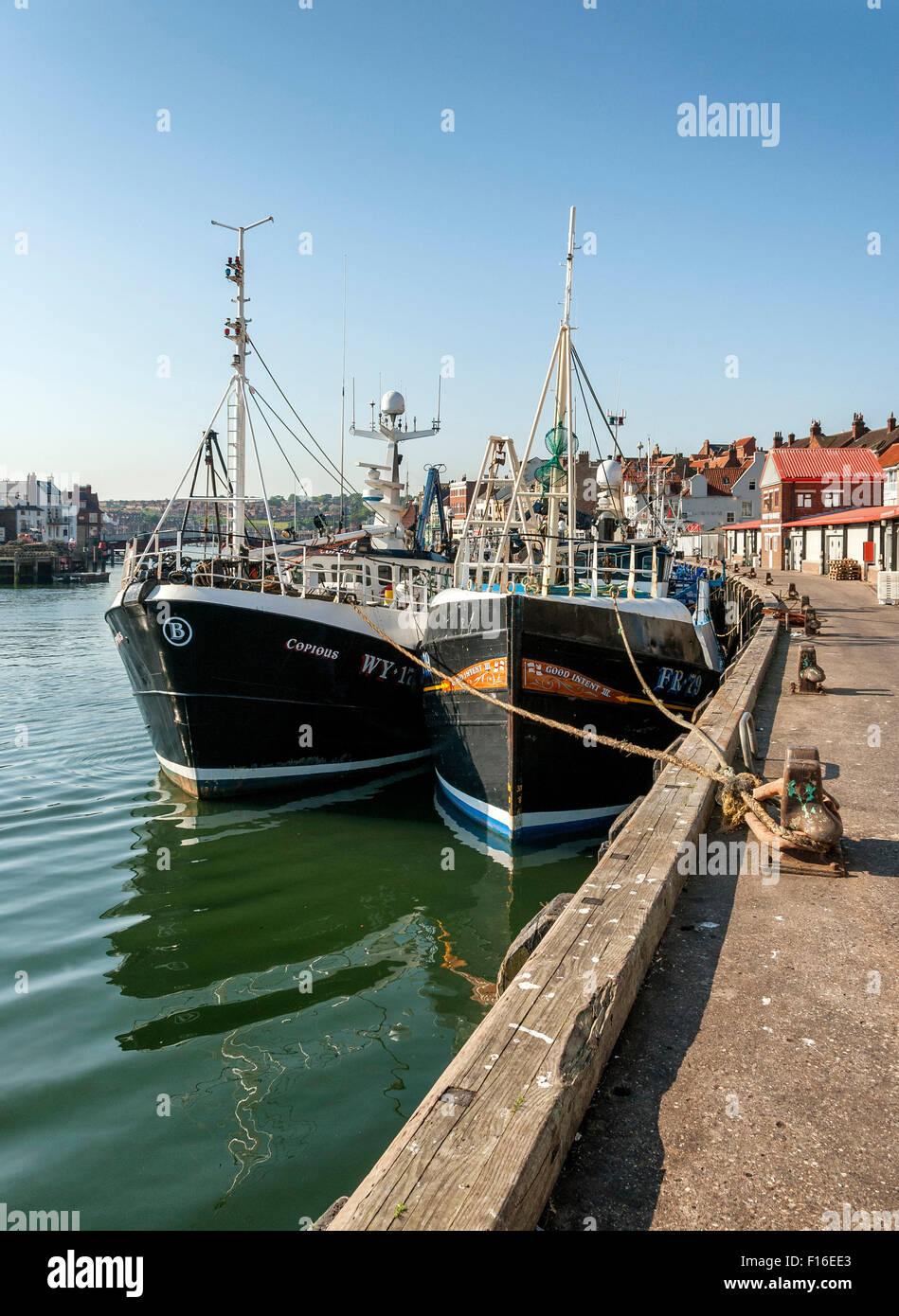 Fishing boats in Whitby harbour on a bright, sunny spring morning Stock ...