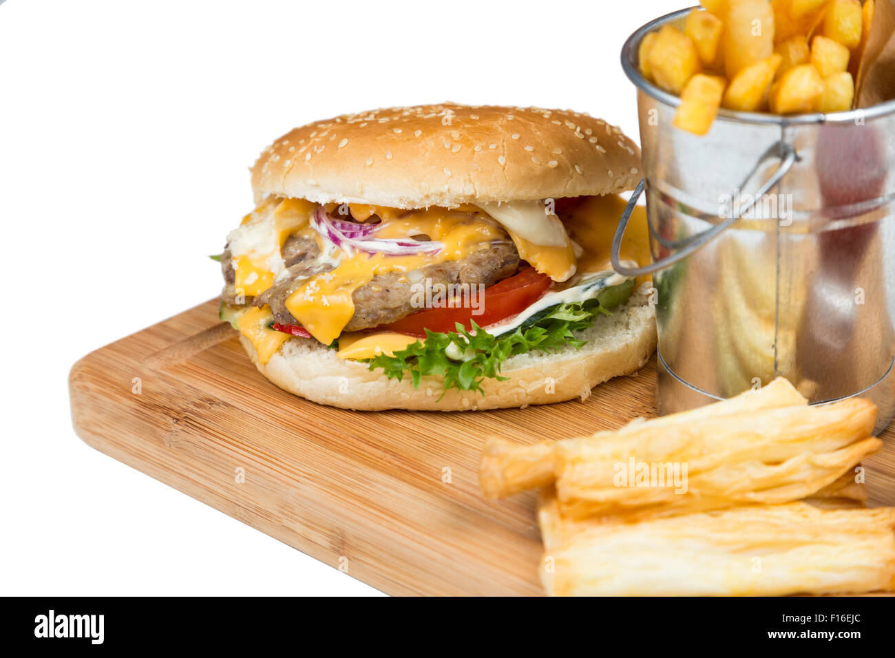 burger with fried potatoes in bucket serving on wooden board Stock ...