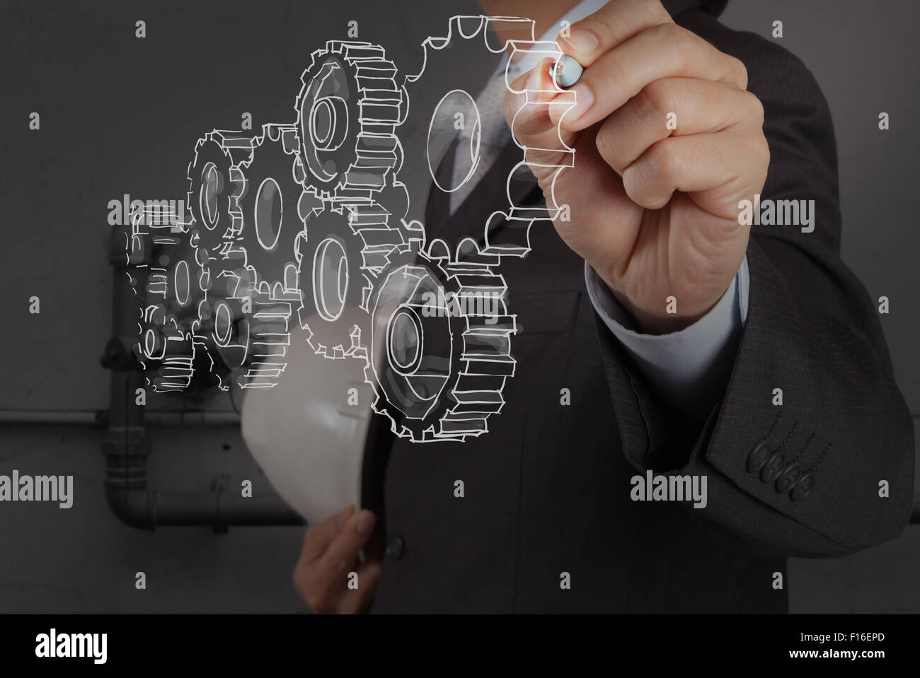 engineer drawing gear with the piping of an industrial waste water ...