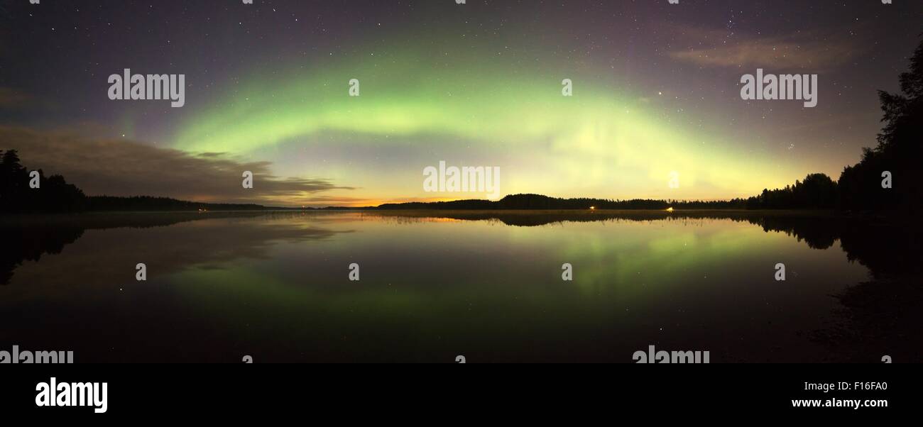 Northern lights with reflection on the lake at night Stock Photo - Alamy