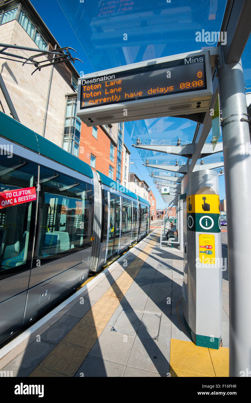 A Nottingham tram at the newly opened station in Beeston ...