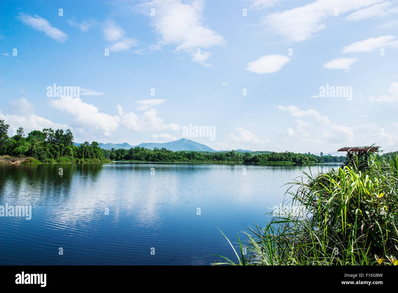 Blue river and blue sky with cloud Stock Photo - Alamy