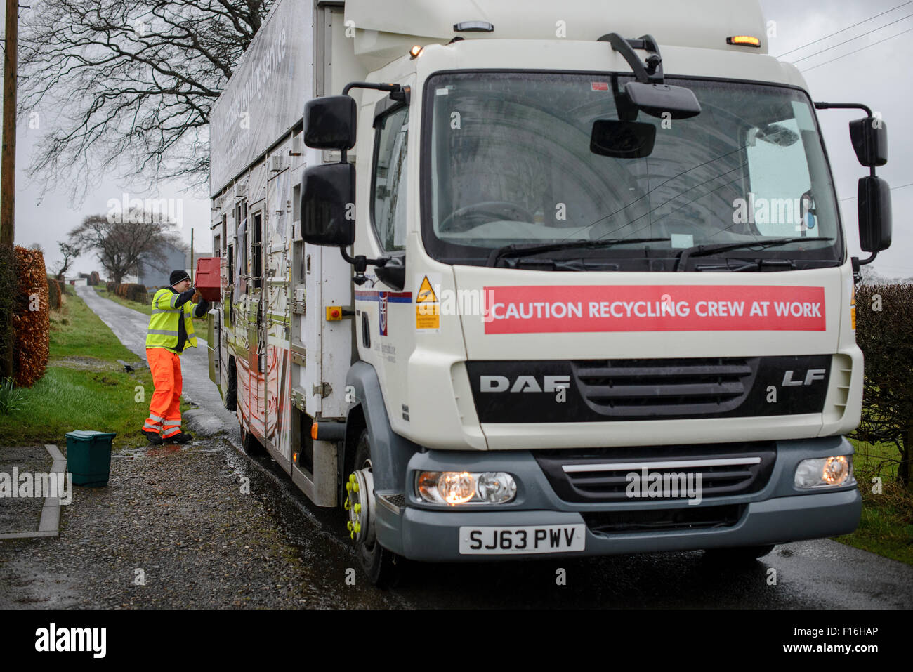 Kerbside recycling collection lorry and workers in rural area Stock ...