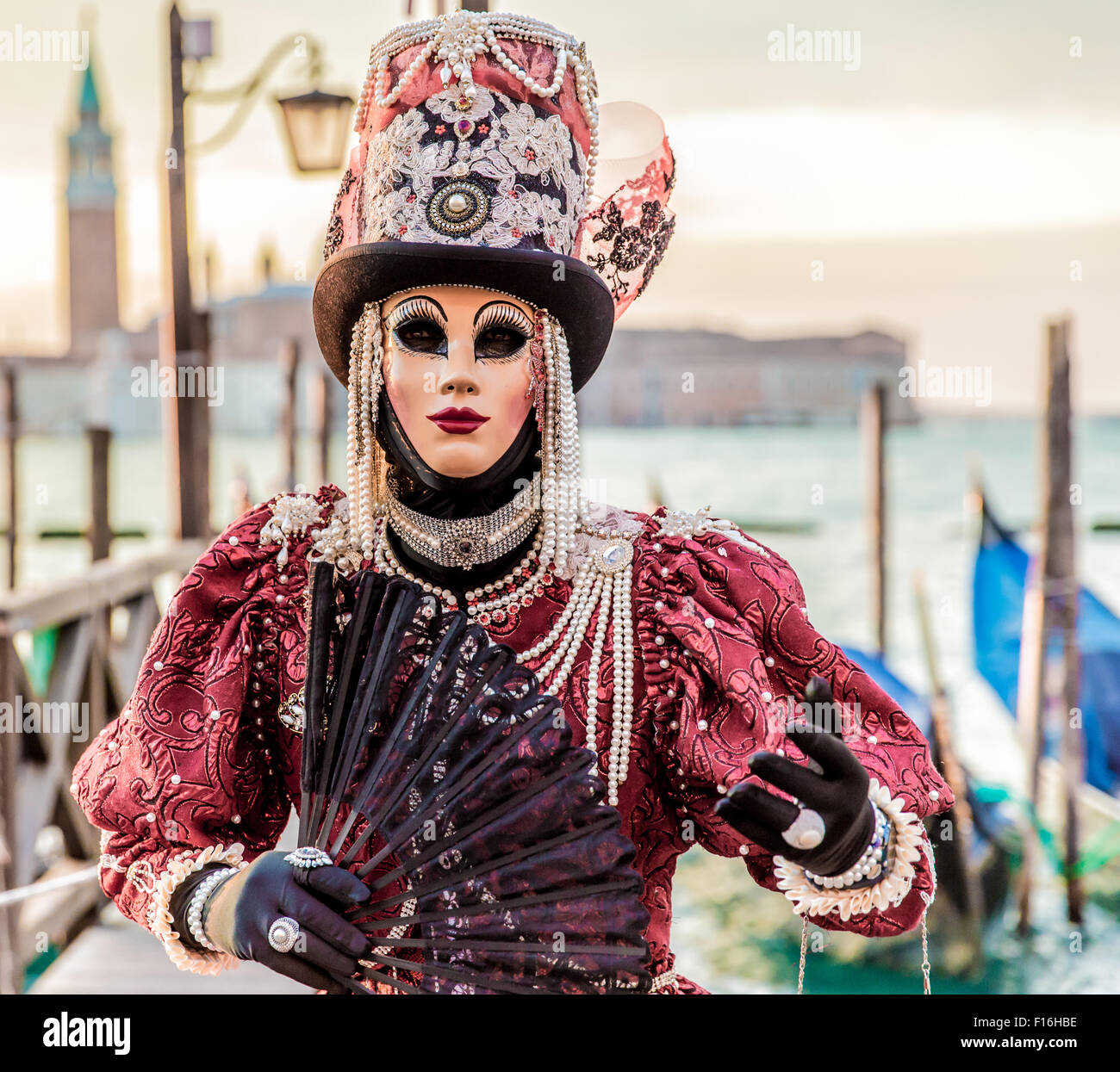 A striking carnival model with a tall top hat Stock Photo - Alamy